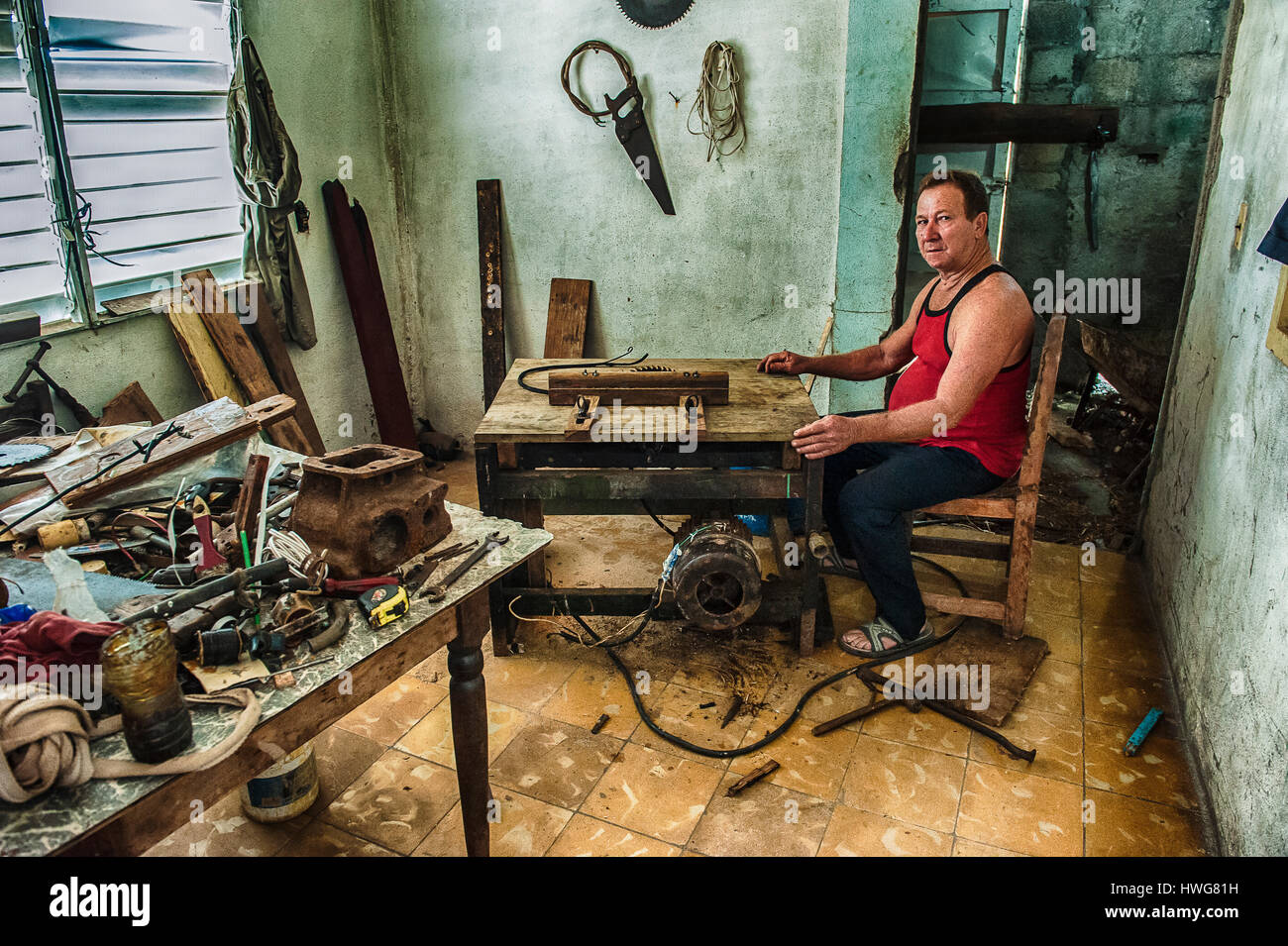 A smith working in his house of Baracoa, Cuba Stock Photo - Alamy