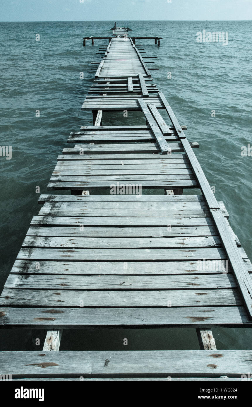 Wooden pier on the sea background Stock Photo - Alamy