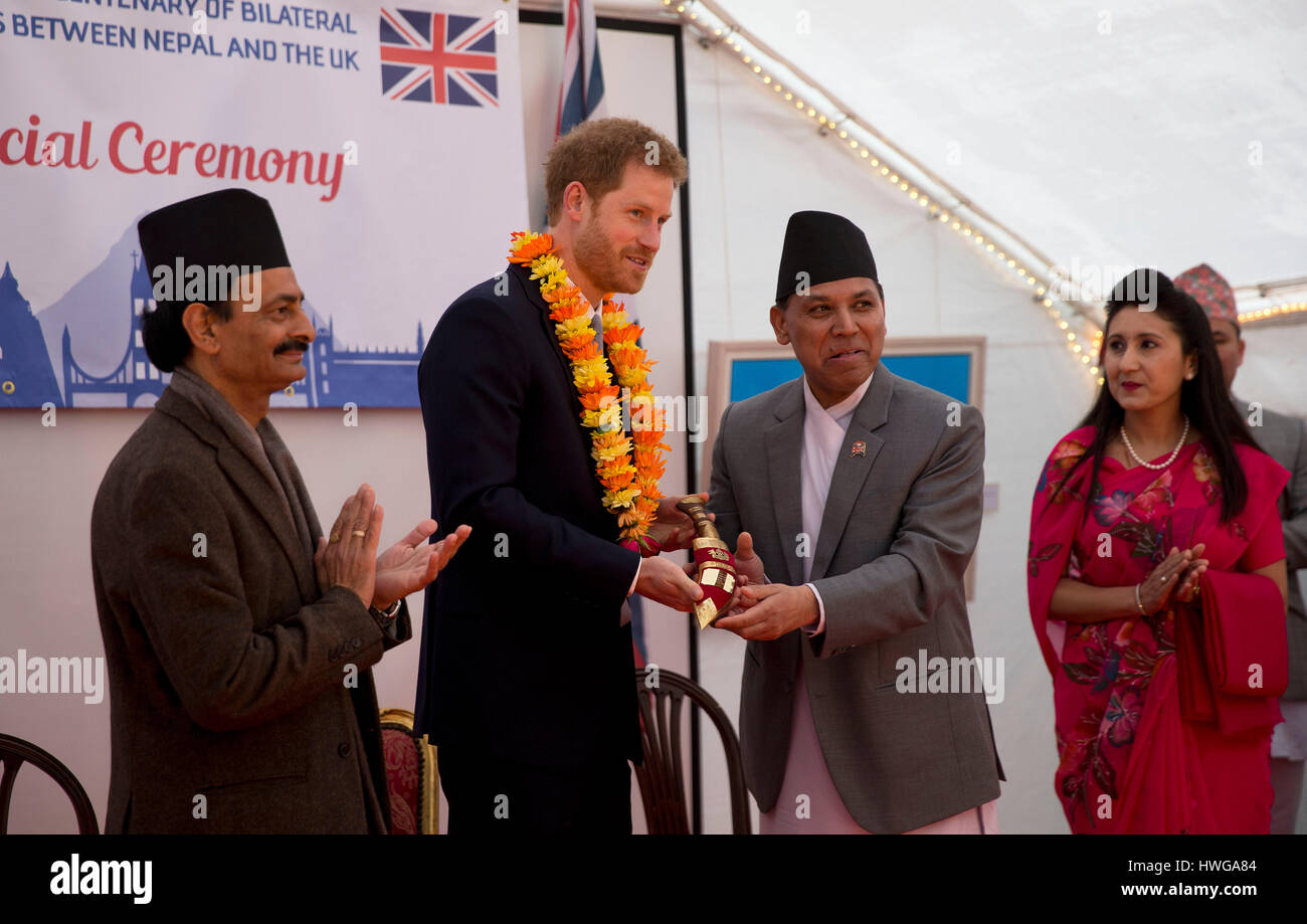 Prince Harry wears a garland during a ceremony to celebrate the ...