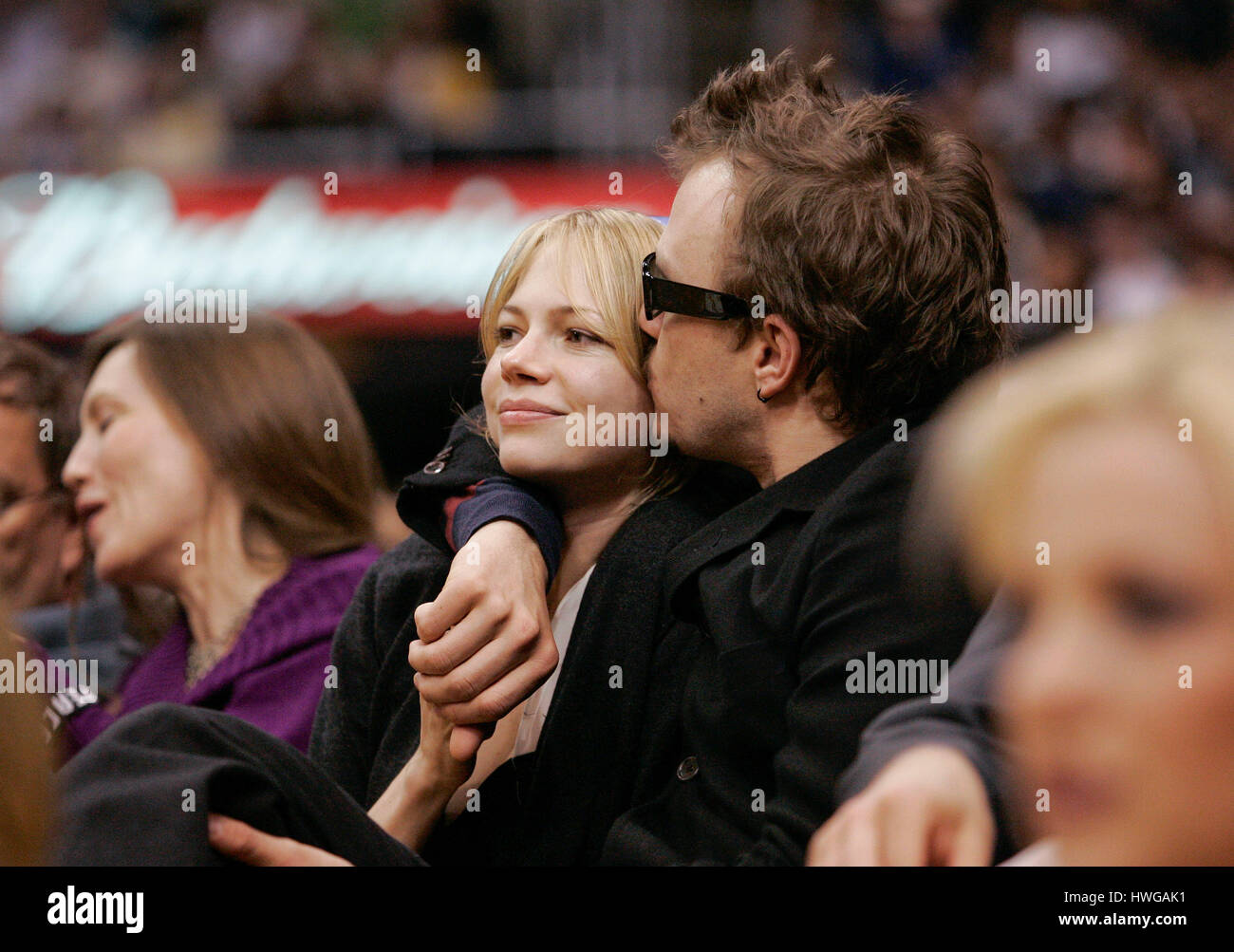 Australian actor Heath Ledger, right, kisses his girlfriend, actress ...