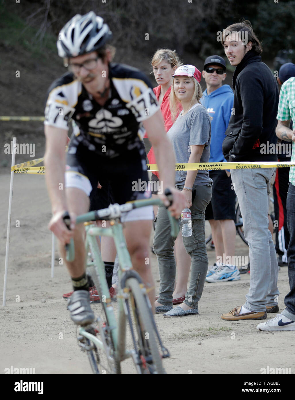 Actress Erika Christensen, with white cap, watches cyclocross bicycle ...