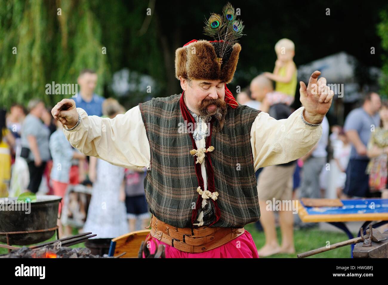 Blacksmith in a hat and with a thick long mustache Stock Photo - Alamy