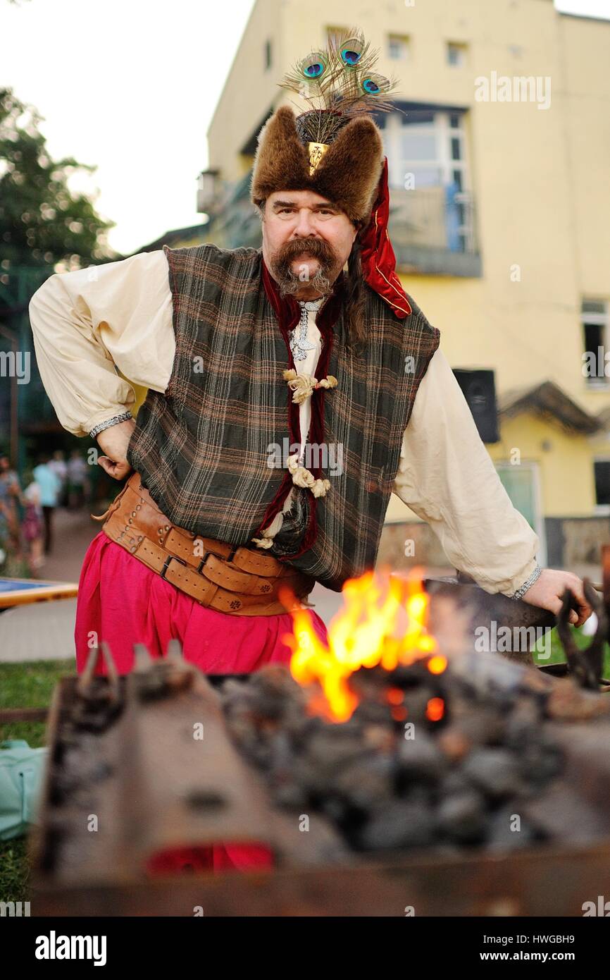 Blacksmith in a hat and with a thick long mustache Stock Photo - Alamy
