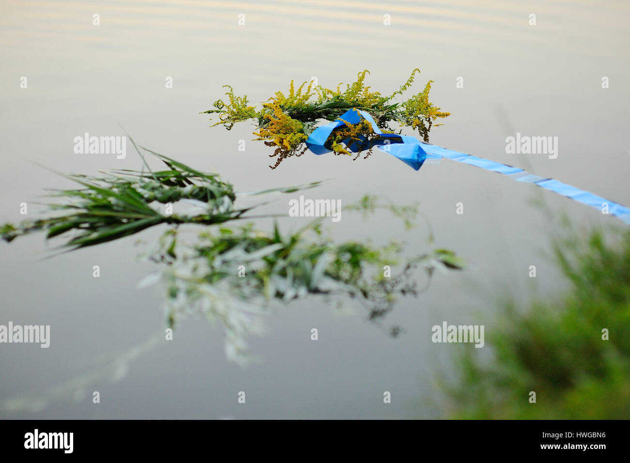 Wreaths of wild flowers on the water Stock Photo - Alamy