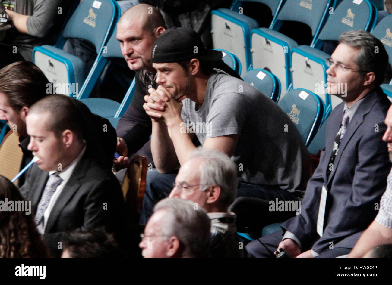Bodyguard Pascal Duvier, left, watches with actor Josh Duhamel cage ...