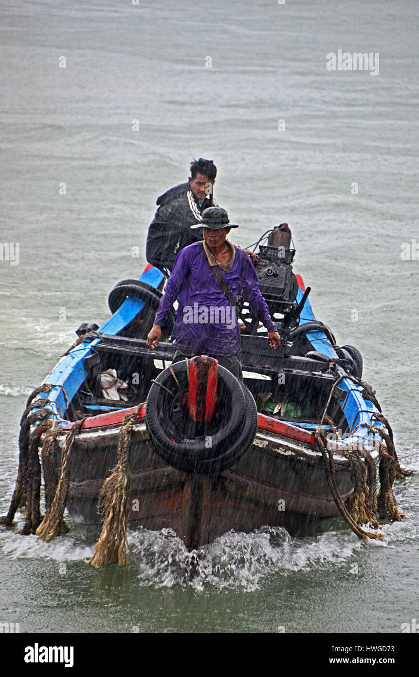 A boat approaches the pier in the harbour at Myeik, Myanmar, during a ...
