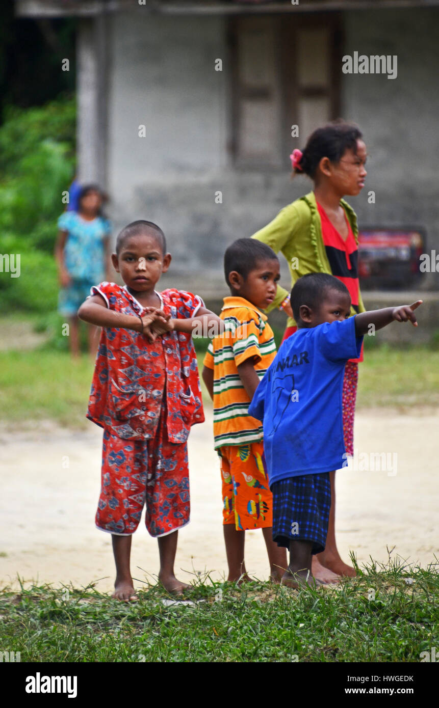 Children stand outside the school in the village of Makyone Galet ...