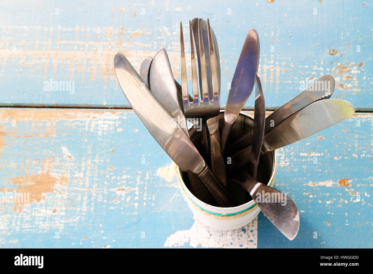 cutlery in pot on table Stock Photo - Alamy