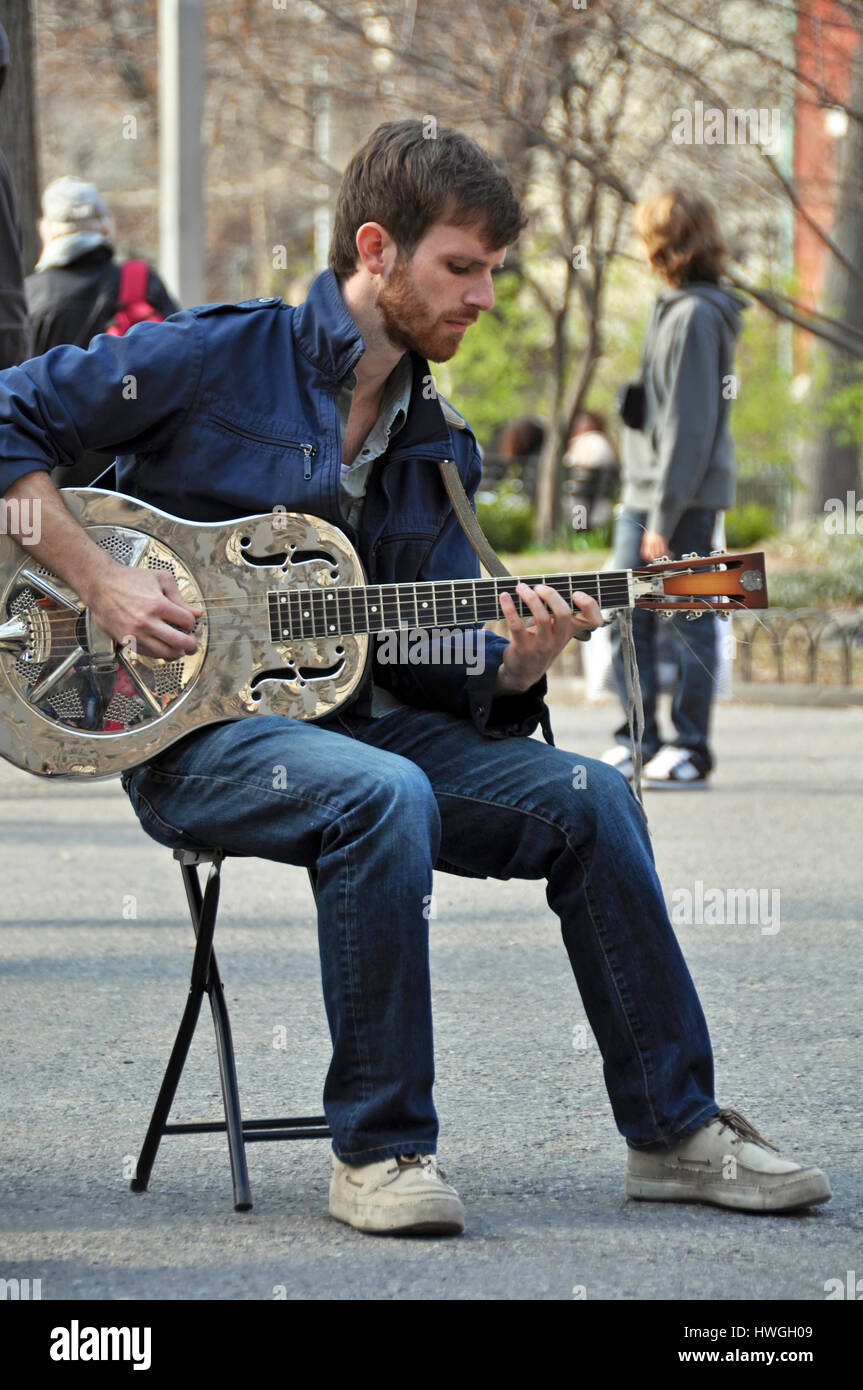 New York, USA - April 09, 2008: A Blues musician plays his Dobro guitar ...