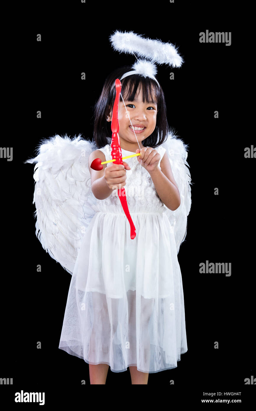Happy Asian Chinese Little Angel WIth Bow And Arrow in isolated dark ...