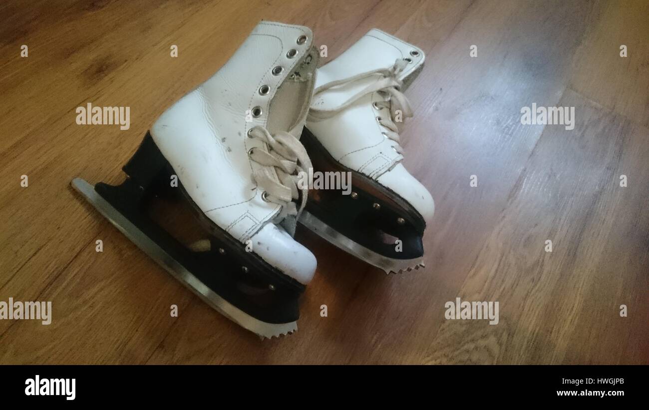Skates lying on the floor Stock Photo - Alamy