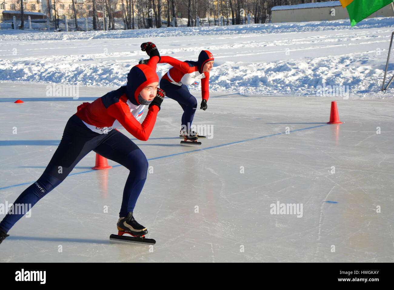 Skating. Training for riding on skates on the ice Stock Photo - Alamy