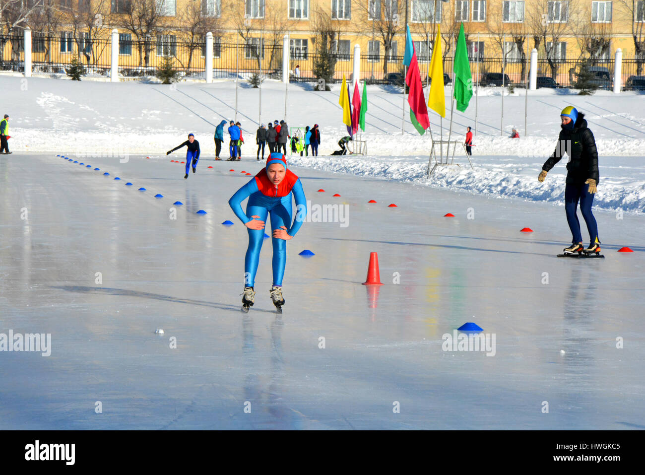 Skating. Training for riding on skates on the ice Stock Photo - Alamy