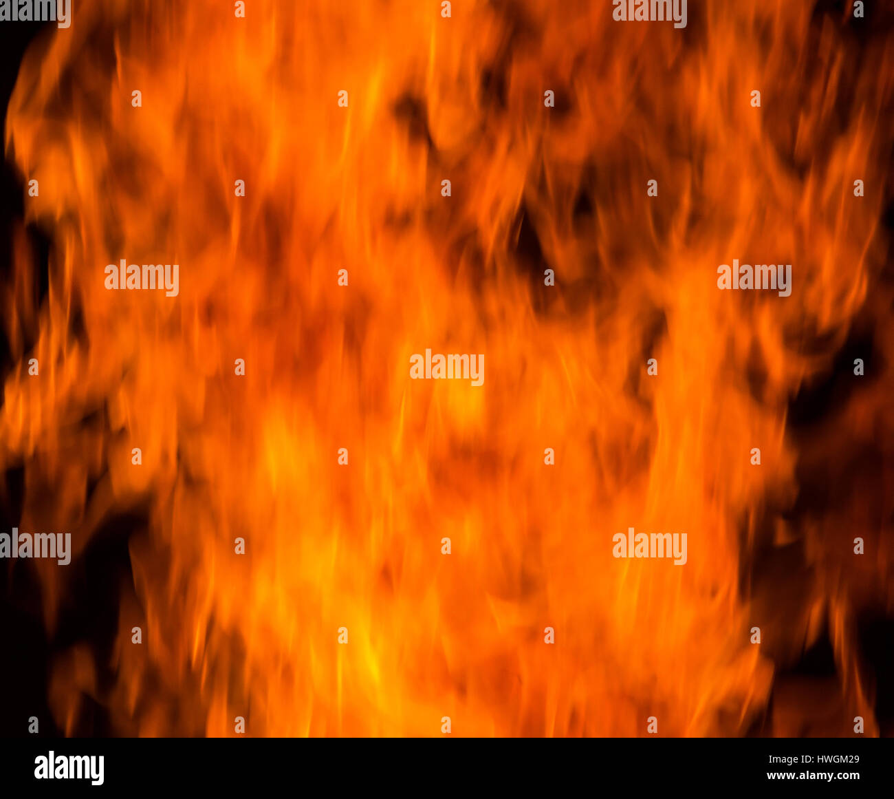 Background of fire. Texture fire flames throughout the space. Fire red ...