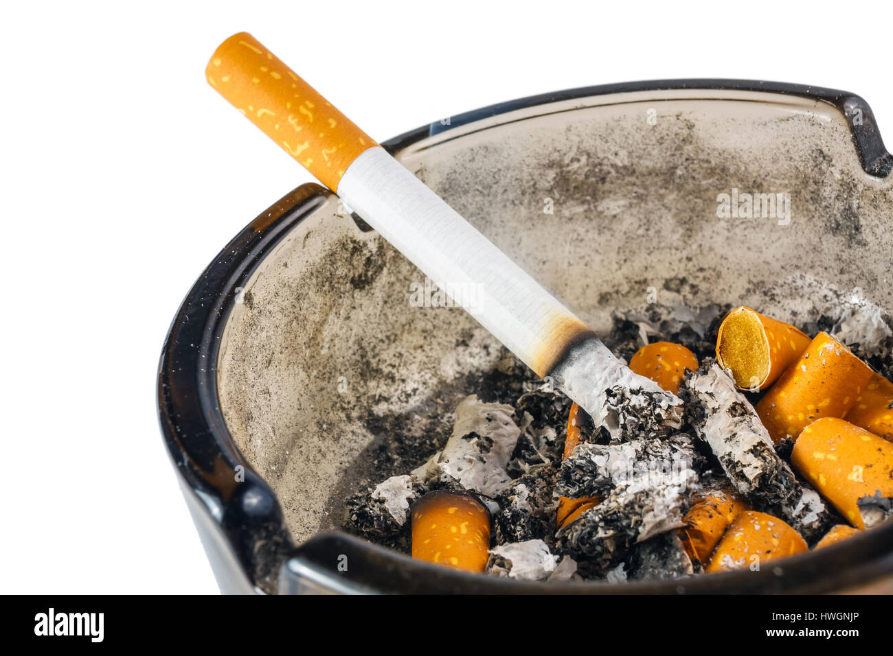 Close up of cigarette in ashtray on white background Stock Photo - Alamy