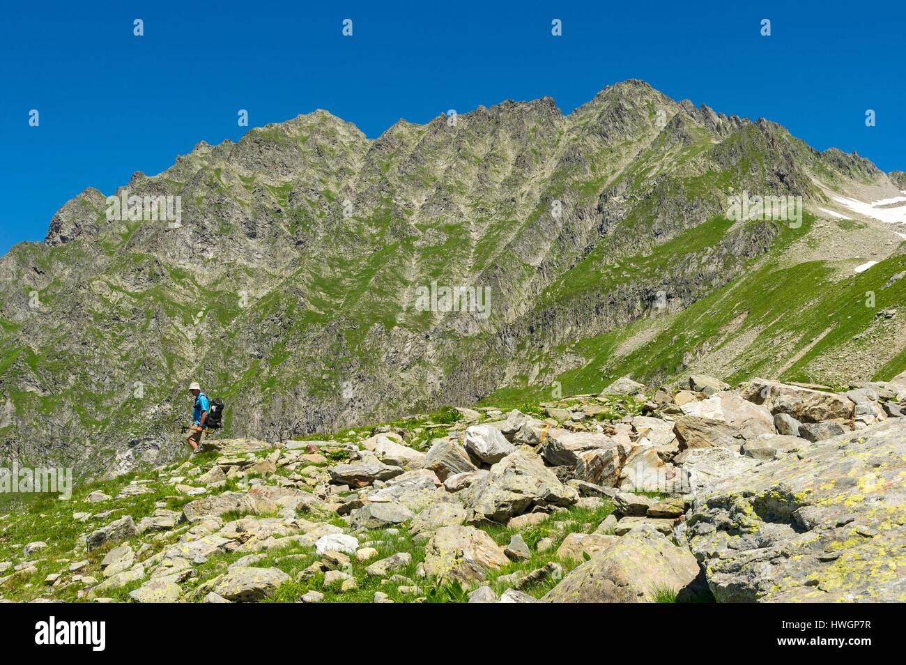 France, Isere, Allevard, Hiker descending off piste towards the Refuge ...