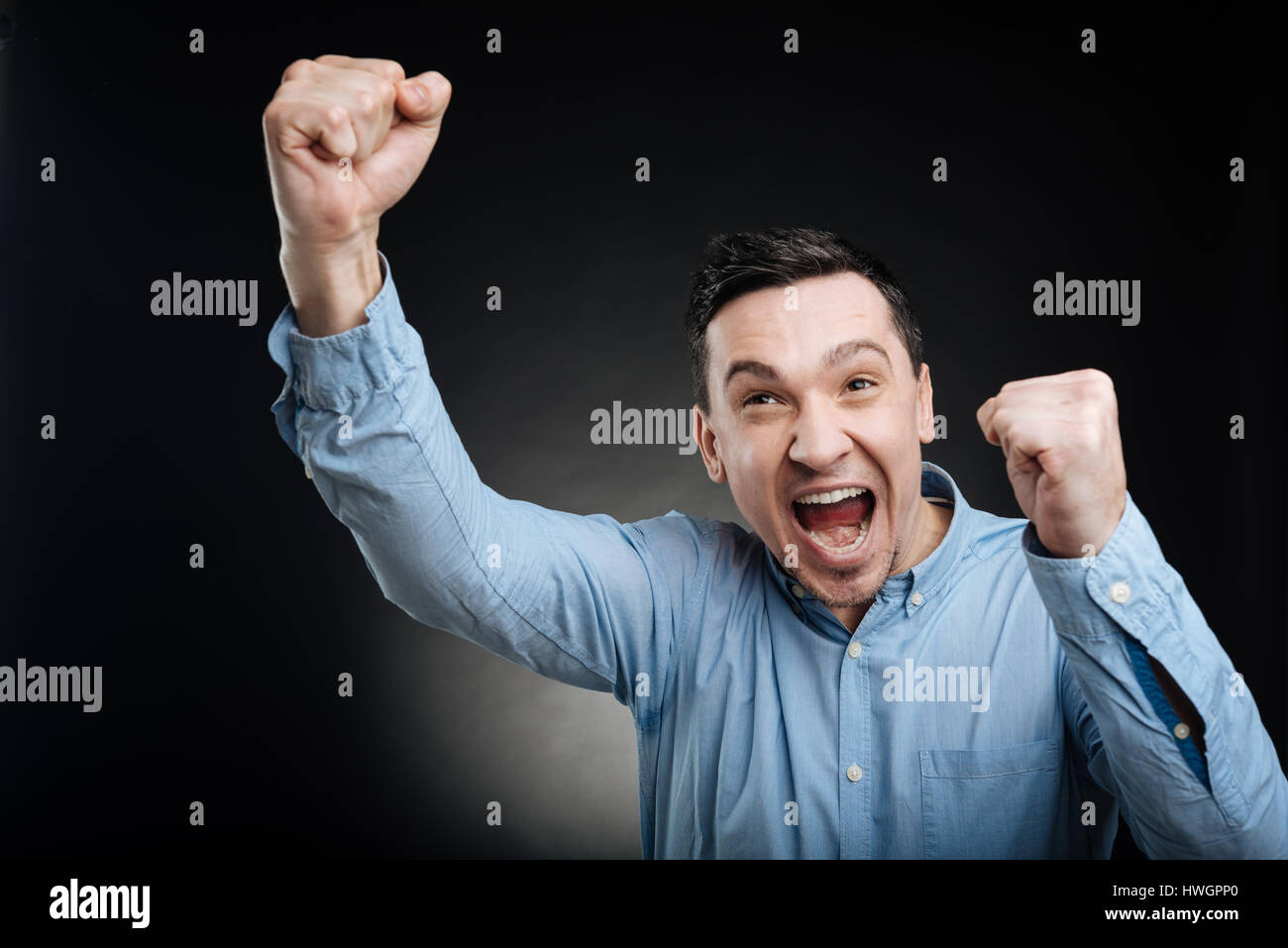 Happy man rising his hands up Stock Photo - Alamy