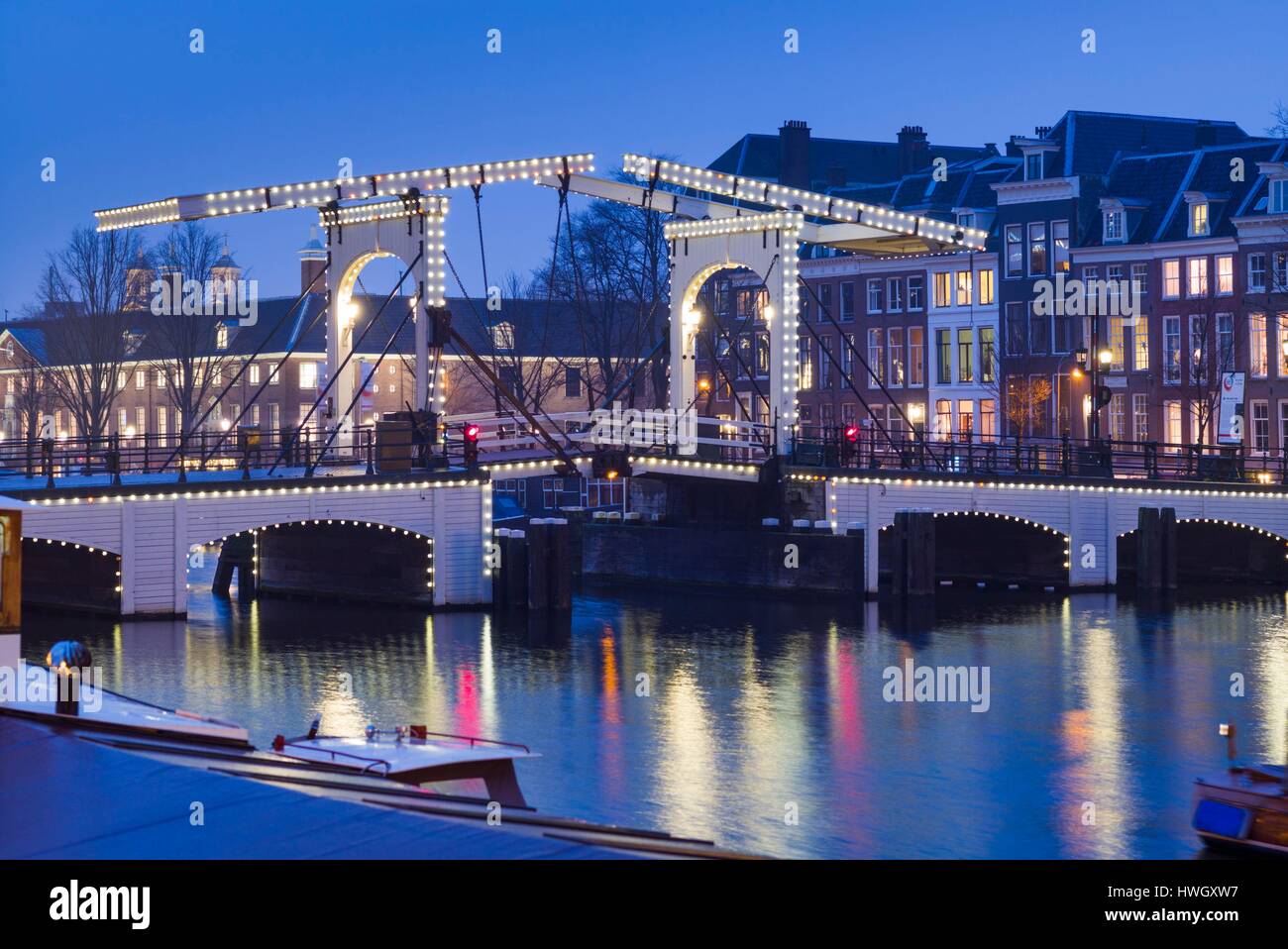 Netherlands, Amsterdam, Magere Brug, the Skinny Bridge, dusk Stock ...