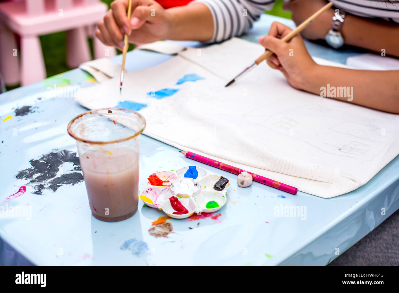 Education, Mixing Water Colors in a painting Class Stock Photo - Alamy