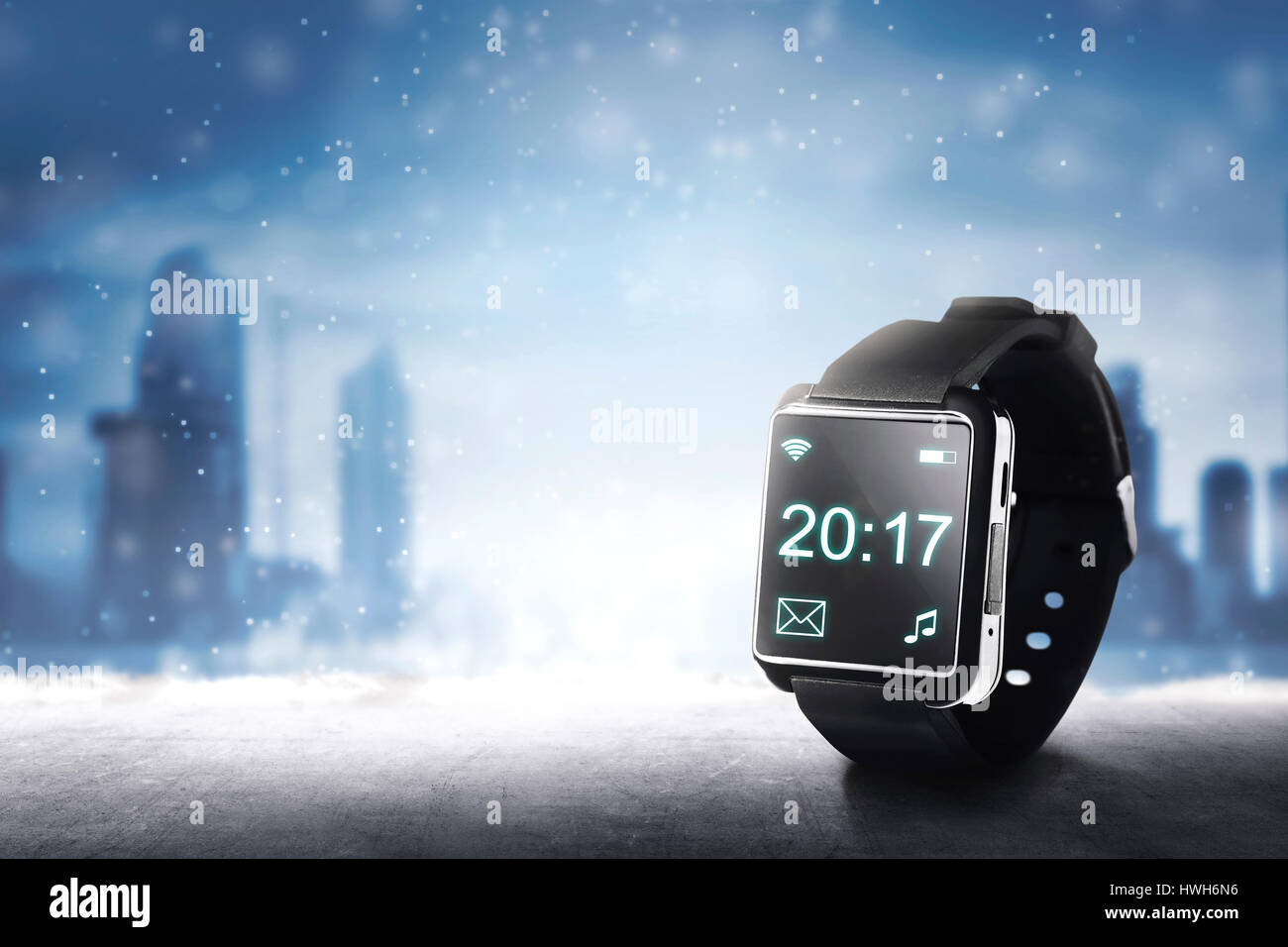 20:17 minutes time on smartwatch become 2017 with snowfall in the city ...