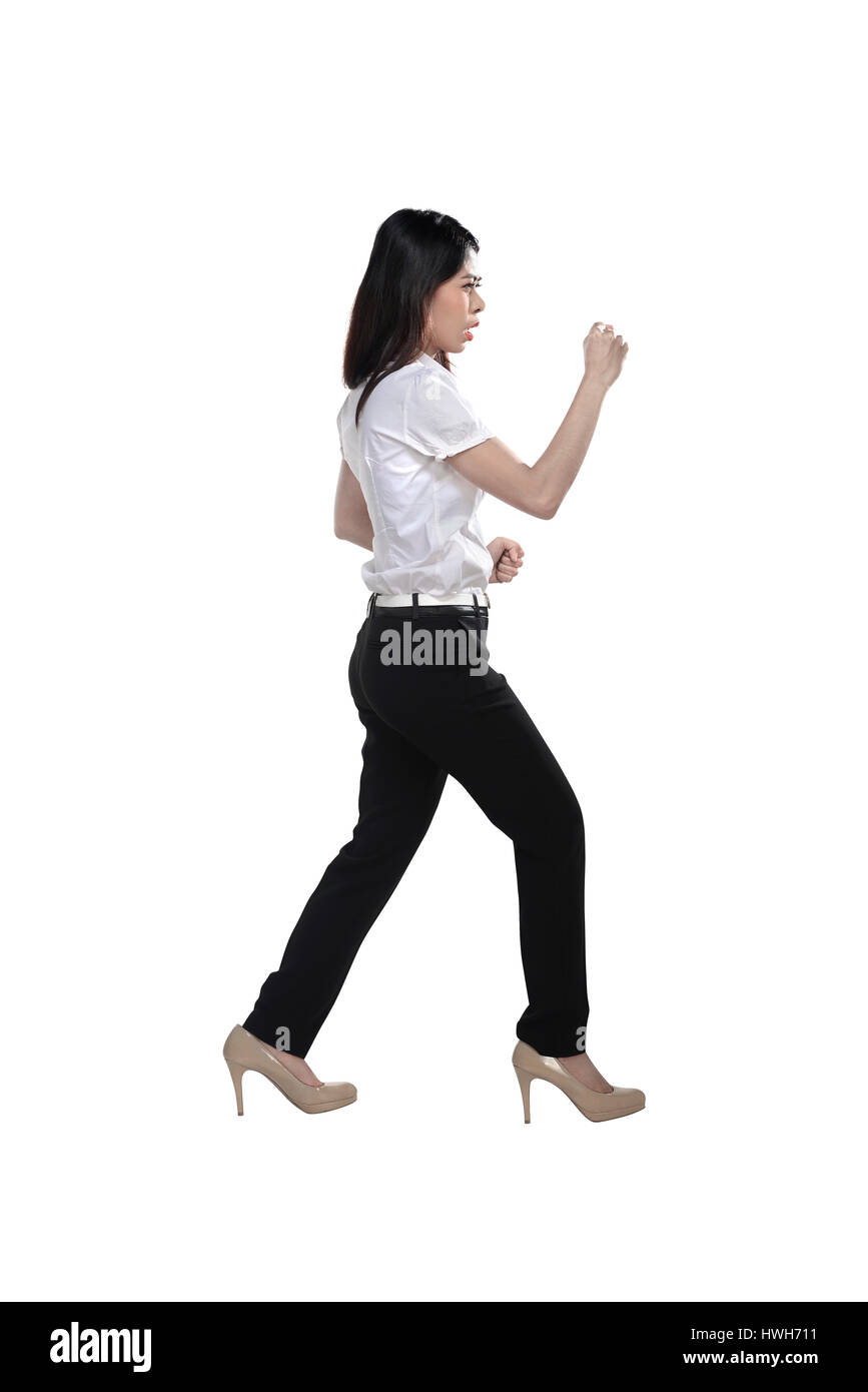Asian business woman doing fight stance isolated over white background ...