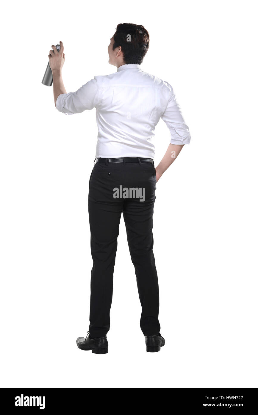 Asian business man spraying something isolated over white background ...