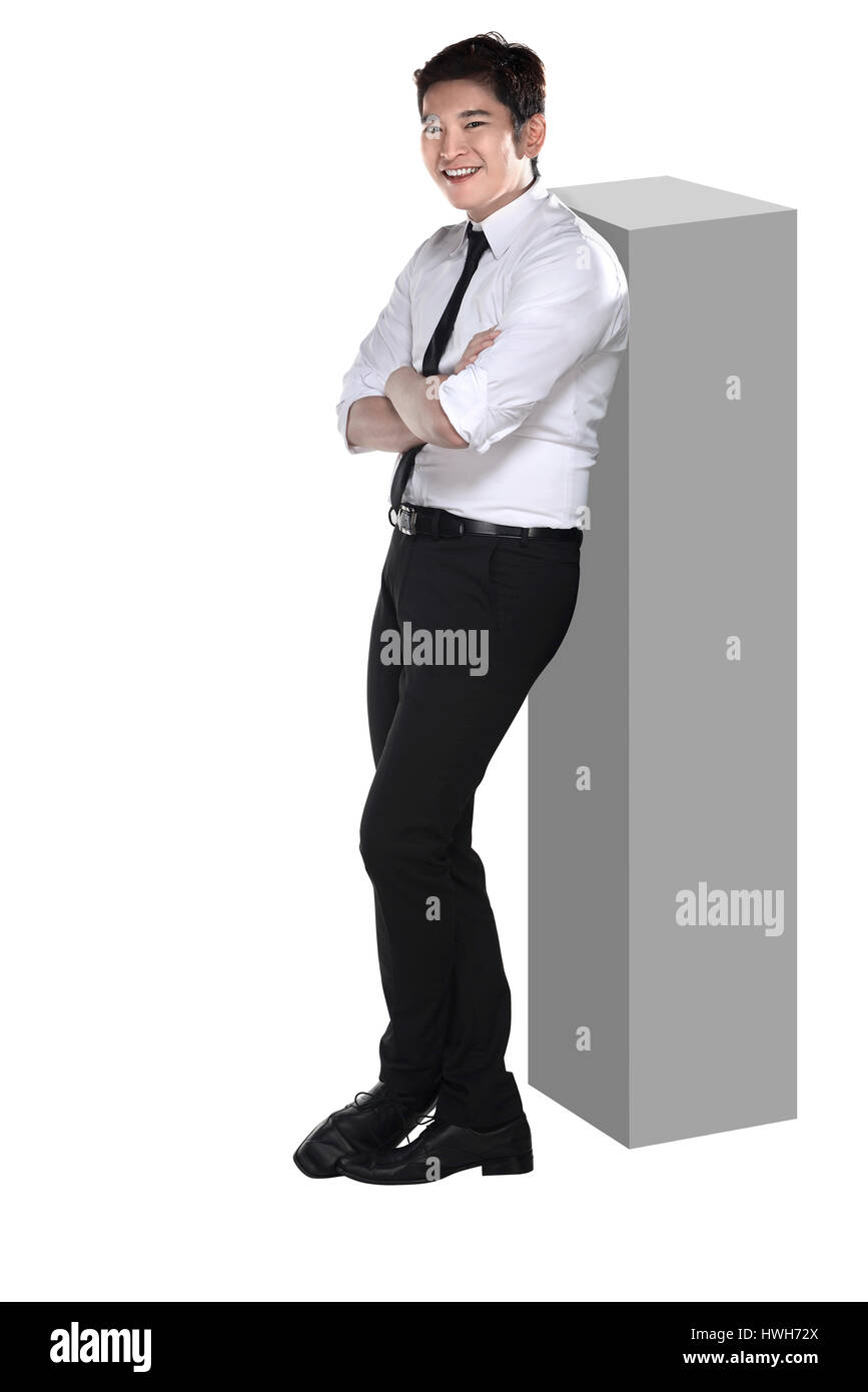 Asian business man lean on the block isolated over white background ...
