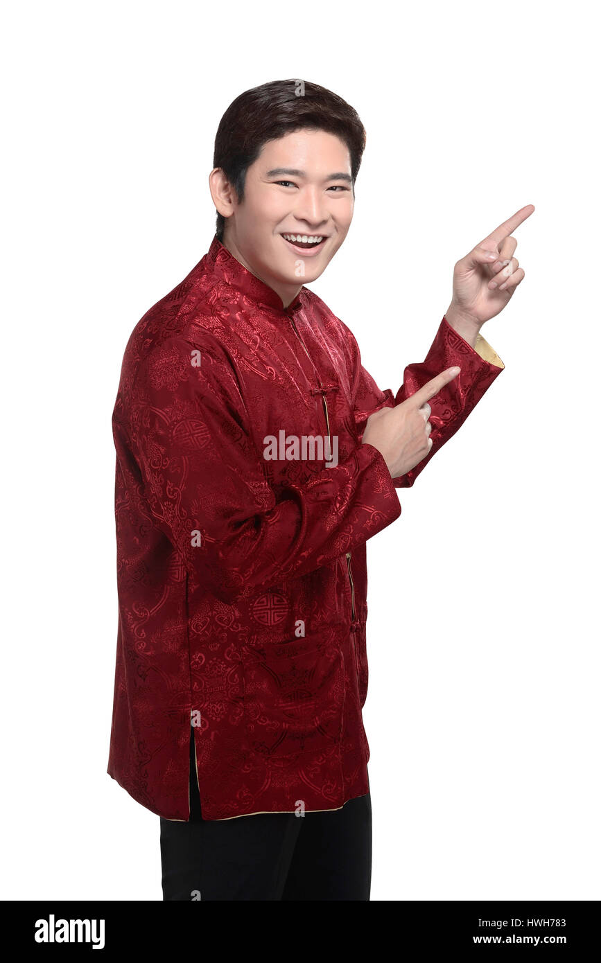 Young chinese man in cheongsam suit isolated over white background ...