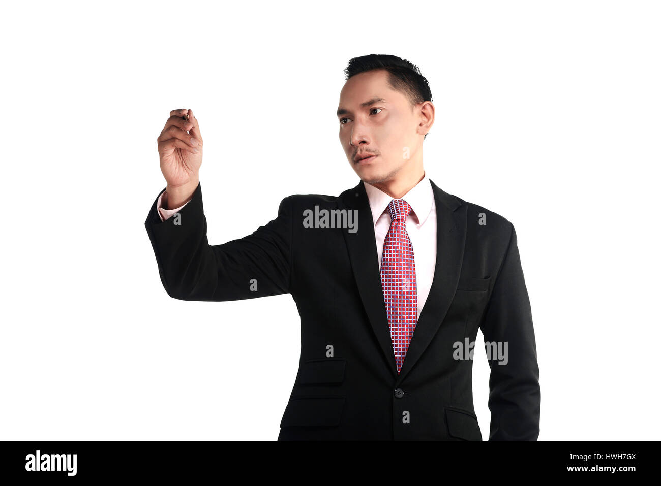 Asian business man writing something with pen isolated over white ...