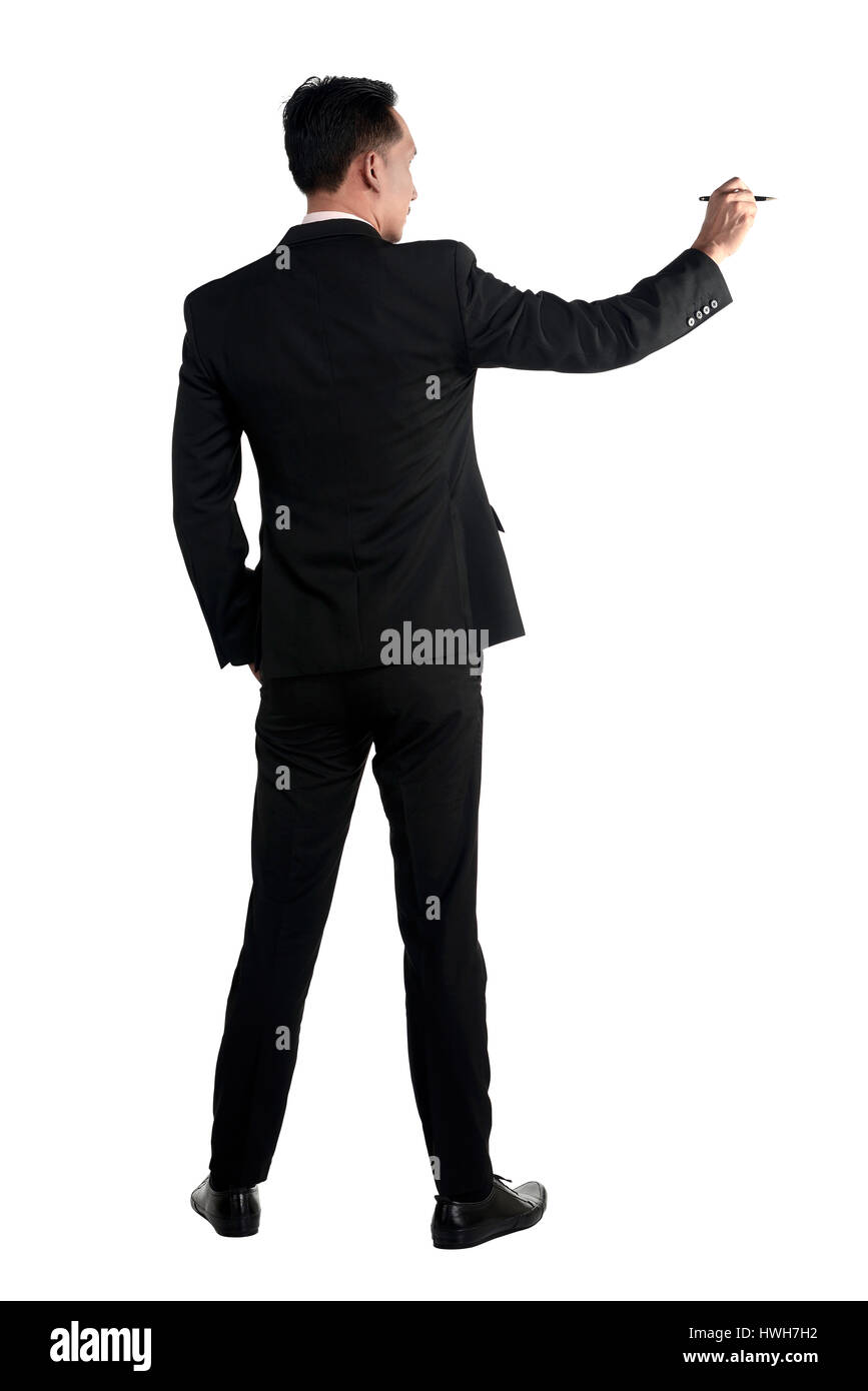 Asian business man writing something isolated over white background ...