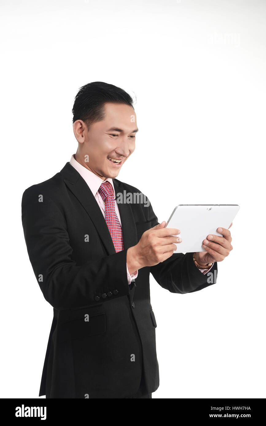 Business man holding computer tablet isolated over white background ...