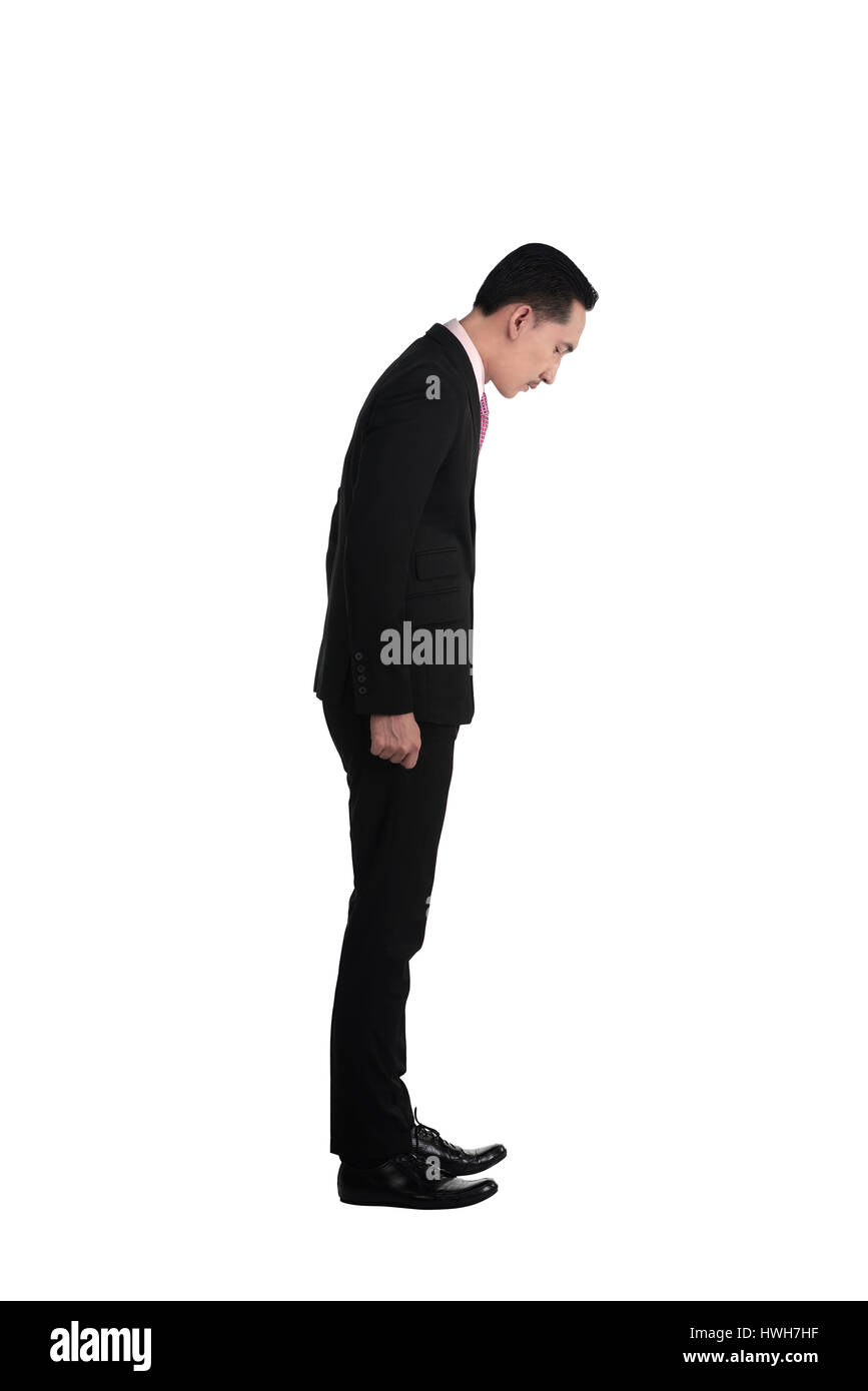 Asian business man looking down isolated over white background Stock ...