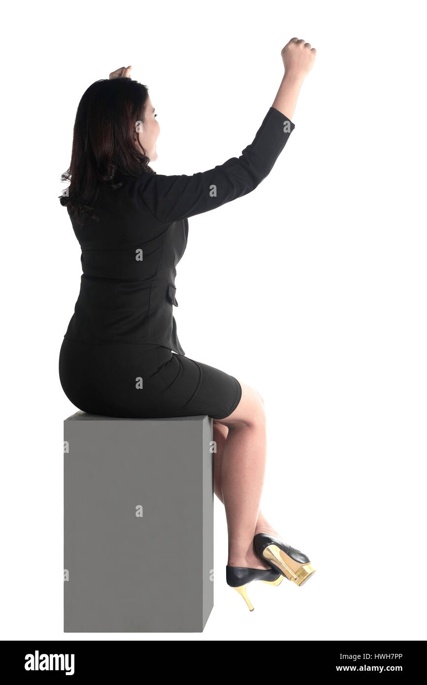 Asian business woman sitting on the block isolated over white ...