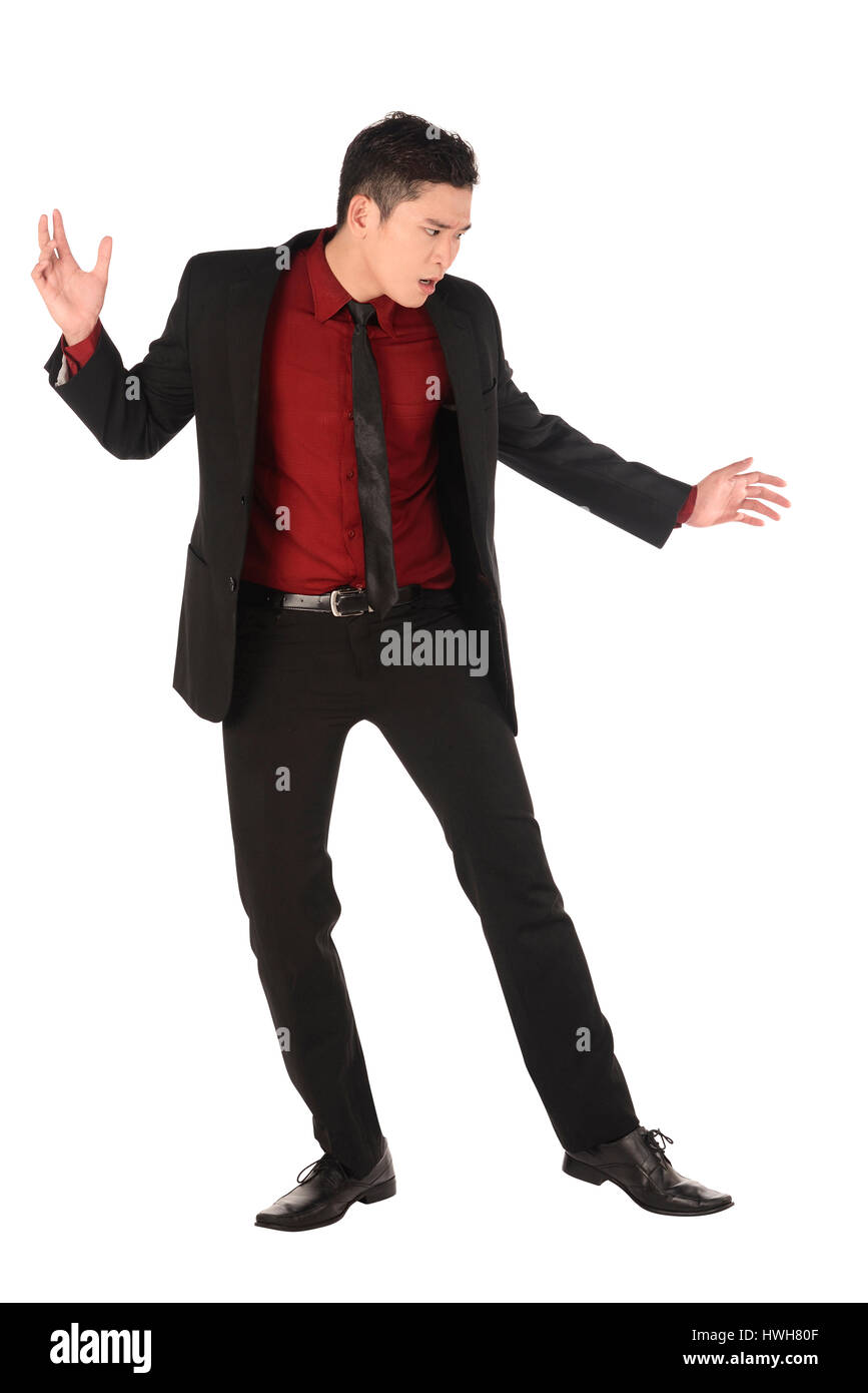 Asian business man with shocking face isolated over white background ...