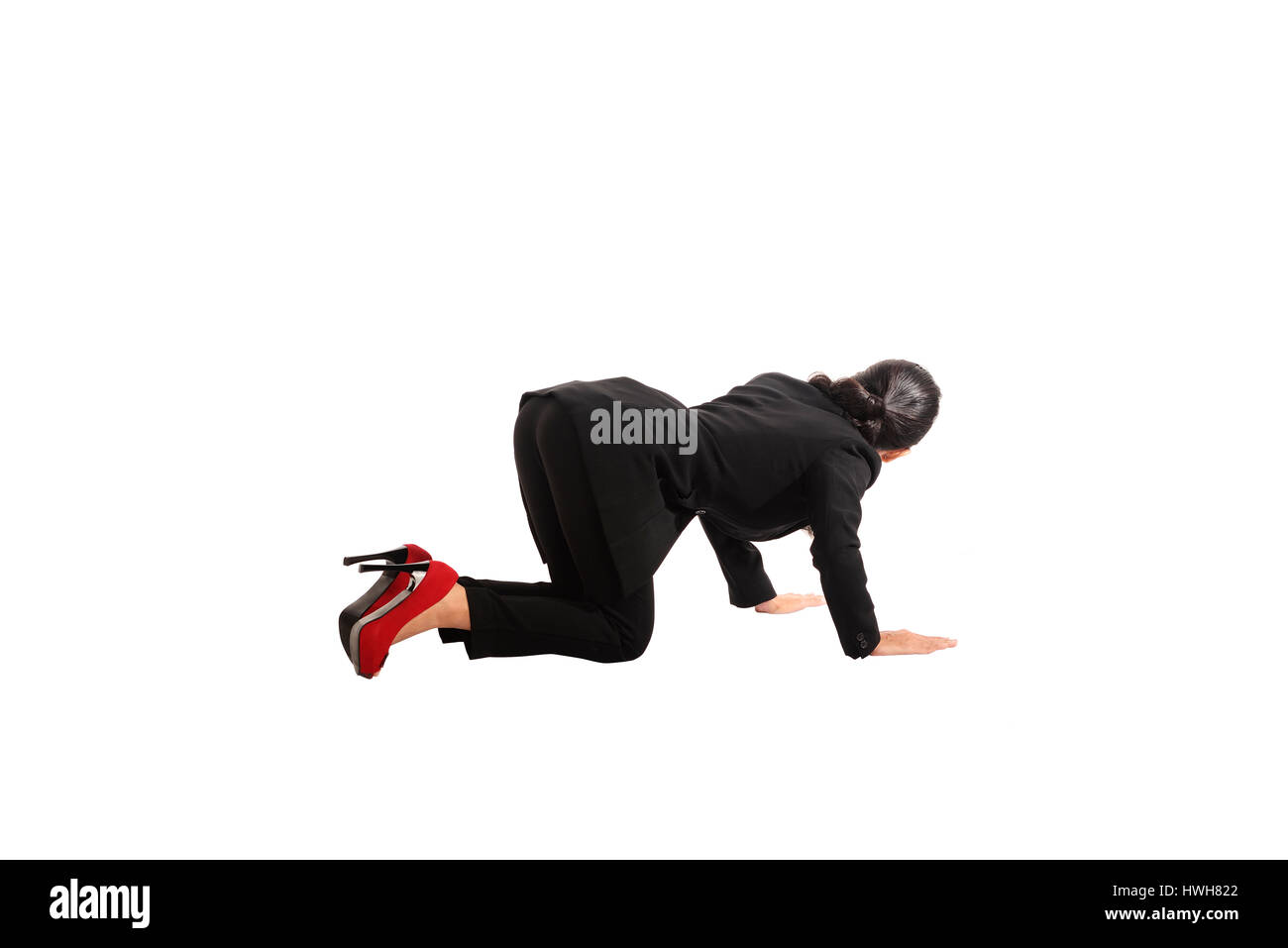 Asian business woman crawling isolated over white background Stock ...