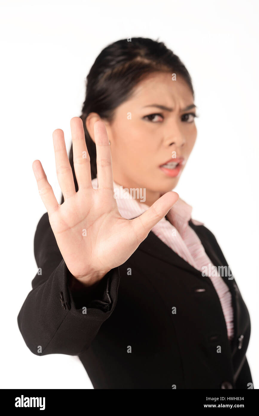 Asian business woman gesturing stop isolated over white background ...