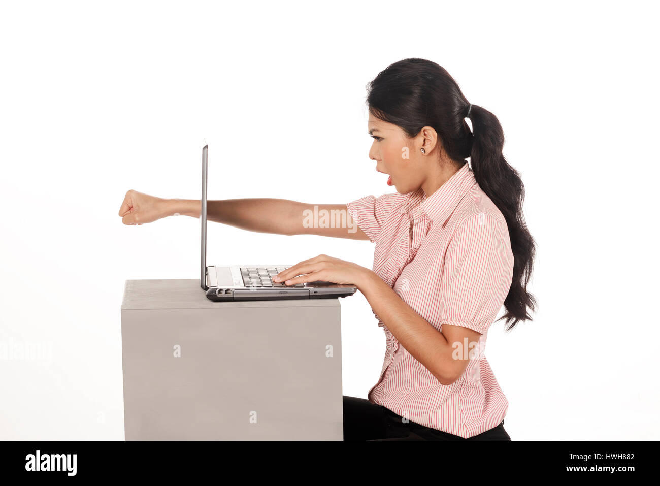 Angry business woman punch laptop isolated over white background Stock ...