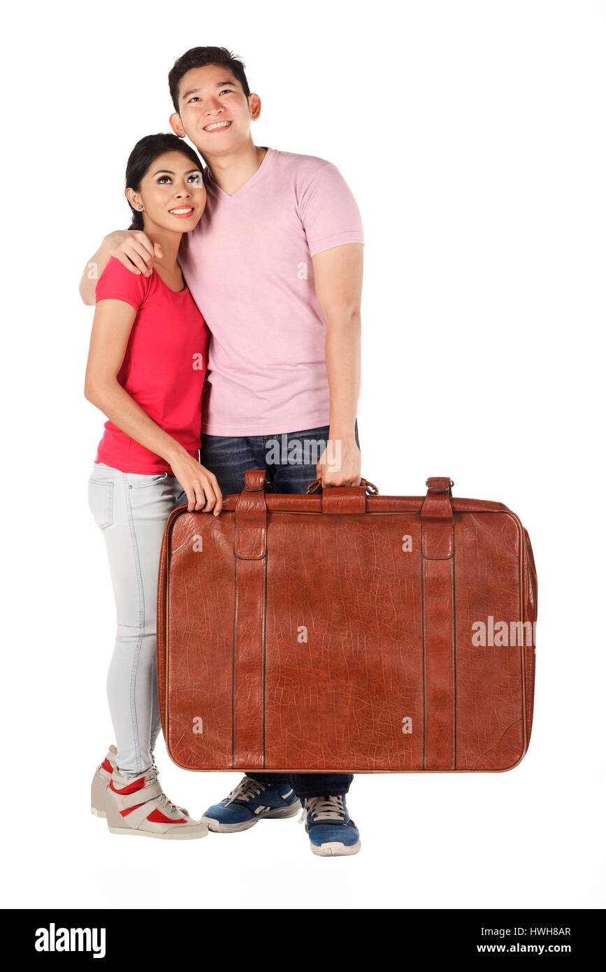 Young couple carrying baggage isolated over white background Stock ...