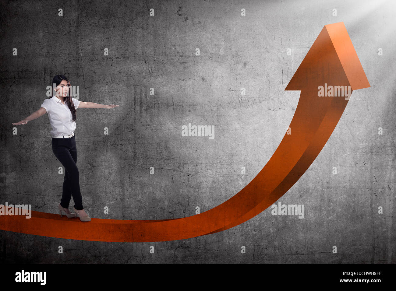 Asian business woman balancing increasing chart Stock Photo - Alamy