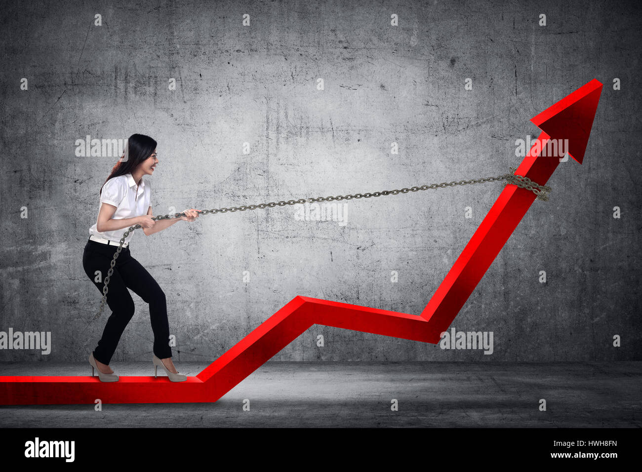 Image of young asian business woman pulling red arrow with chain Stock ...