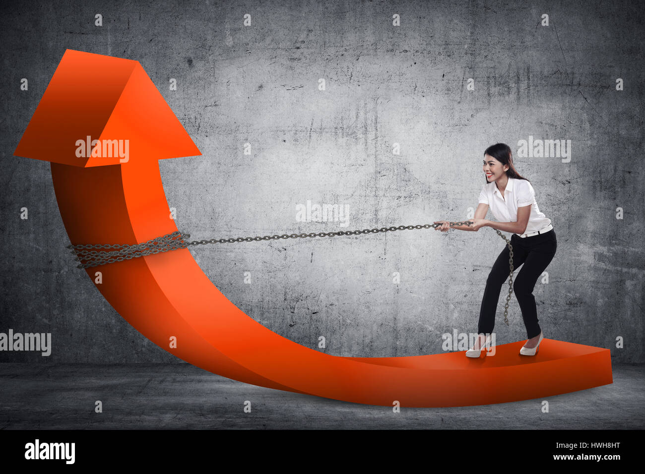 Image of asian business woman pulling red arrow with chain Stock Photo ...