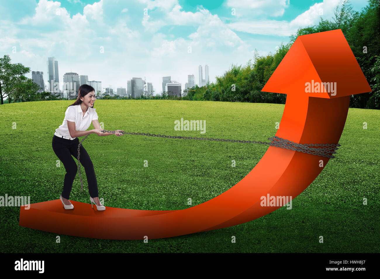 Image of asian business woman pulling red arrow with chain Stock Photo ...