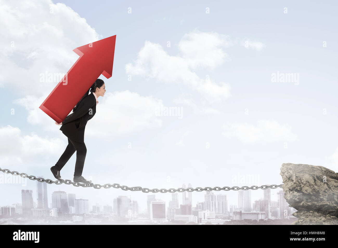 Business man carry heavy red arrow, walking on the chain Stock Photo ...