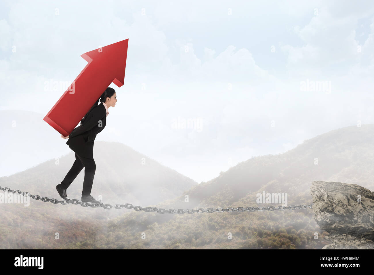 Business man carry heavy red arrow, walking on the chain Stock Photo ...