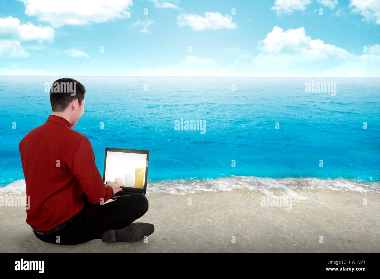 Business man working on the beach with blue sky background Stock Photo ...