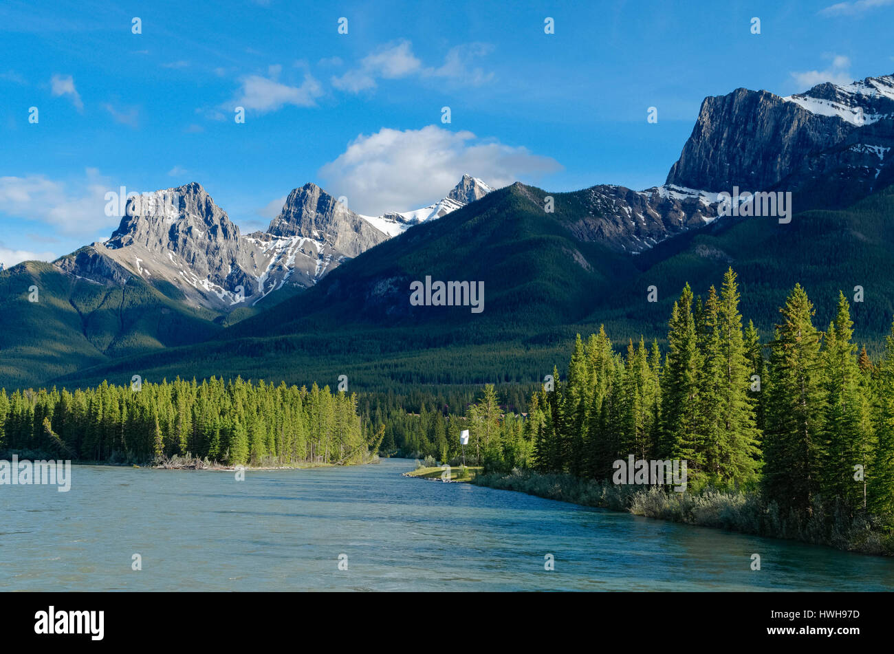 The Three Sisters, mountain peaks. The Bow River, Canmore, Alberta ...