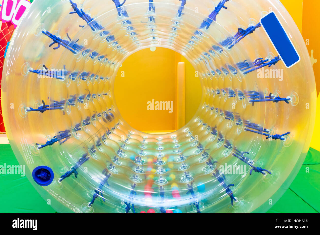Inflatable Roller Wheel at indoor playground Stock Photo - Alamy