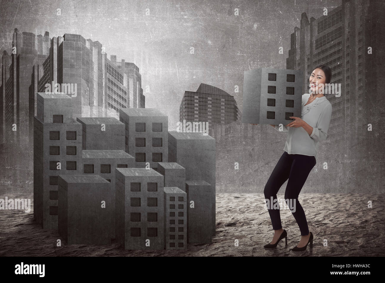 Asian business woman lifting block of city. Building city concept Stock ...