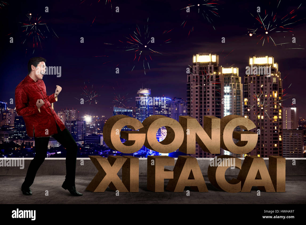 Chinese man saying gong xi fa cai. Happy chinese new year concept Stock Photo - Alamy