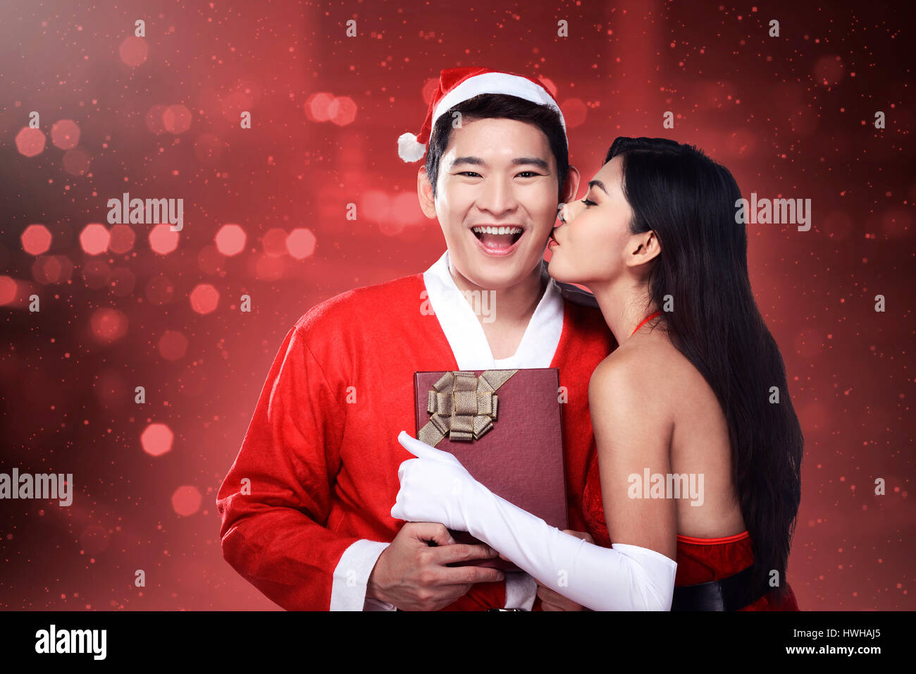 Santa woman give kiss to her lover. Christmas concept Stock Photo - Alamy